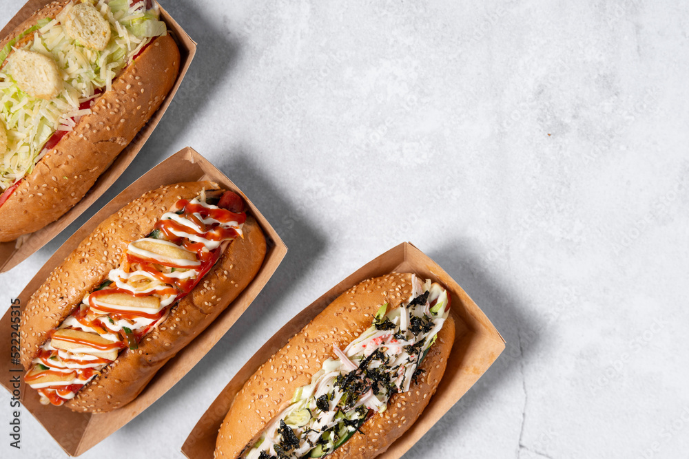 Fast food hot dog banner on a light grey stone textured background ...