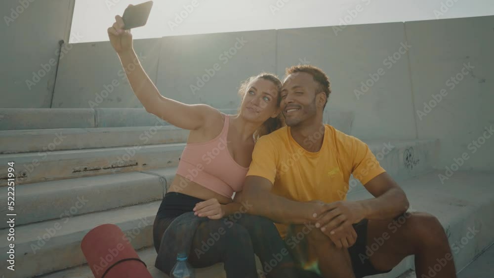 Cinematic video of urban runners athletes training outdoor in a modern ...