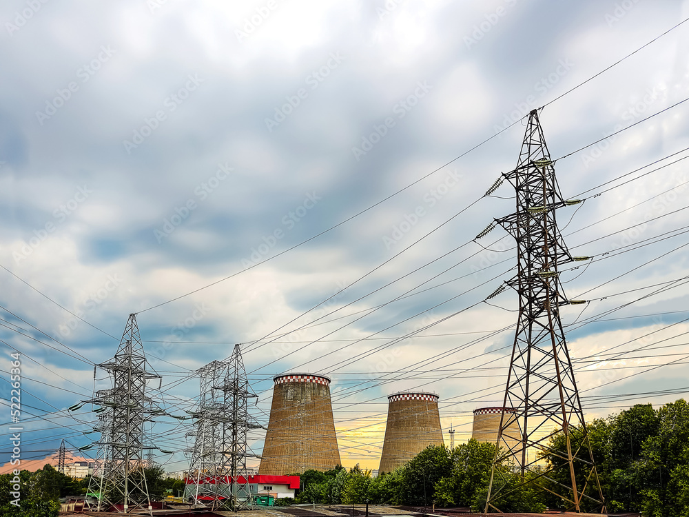 Industrial zone of thermal power plant. Three cooling towers, towers ...