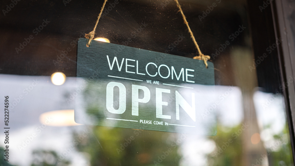"Welcome, open" signboard of the cafe and food restaurant which is ...