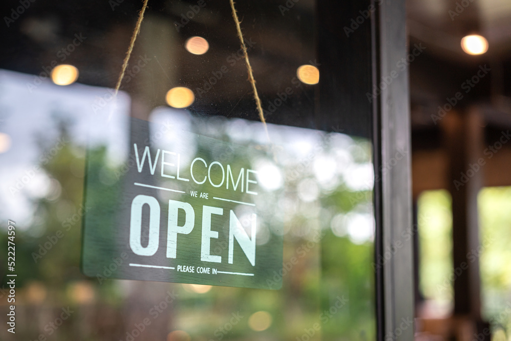 "Welcome, open" signboard of the cafe and food restaurant which is display at the entry. The ...