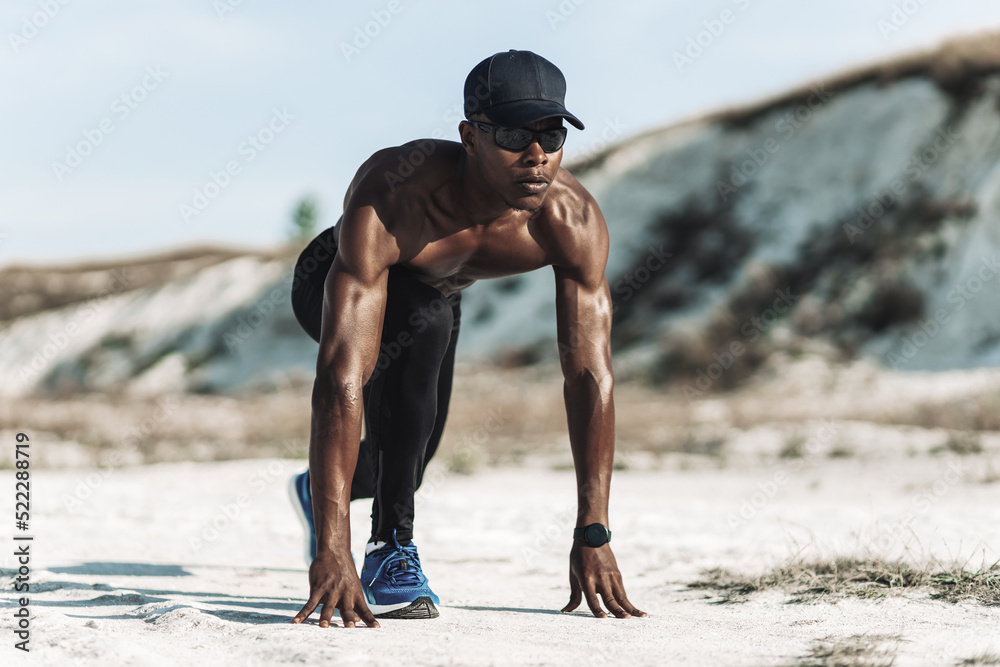 Front view of a handsome young muscular african american runner on ...