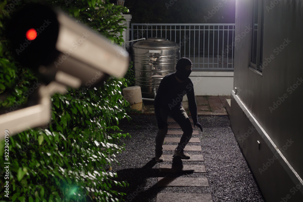 CCTV Surveillance camera capturing thief during breaking into house ...