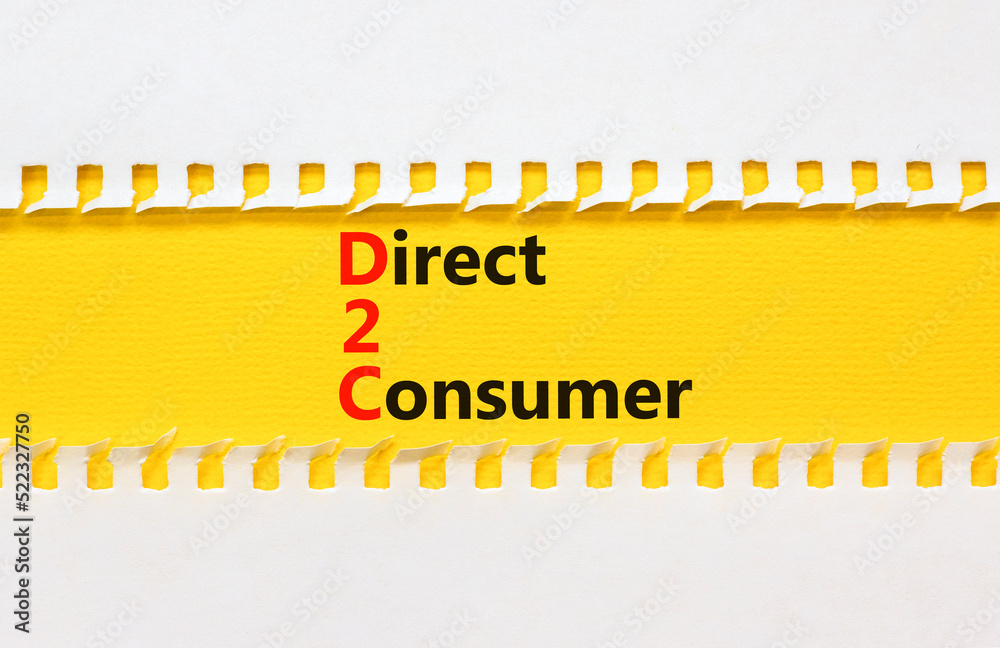 D2C direct to consumer symbol. Concept words D2C direct to consumer on yellow paper on a ...