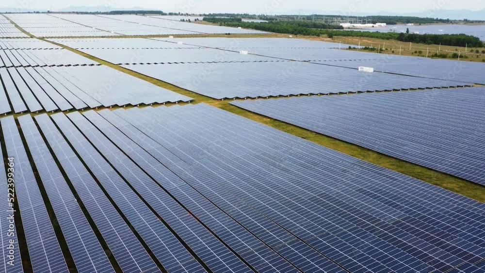 Aerial revealing solar panel farm field. Sustainable renewable energy ...