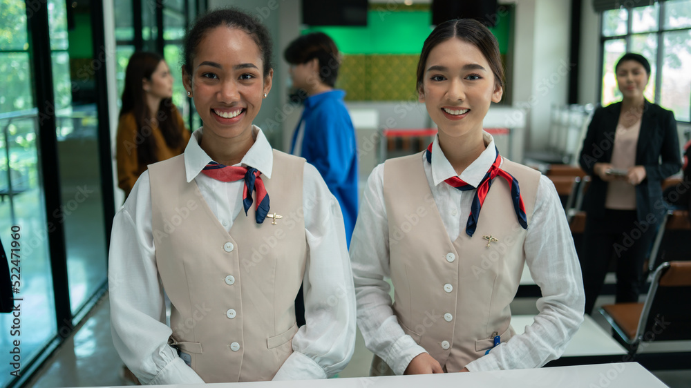 Portrait of beautiful Asian woman airport ground attendant in uniform and standing smile at ...