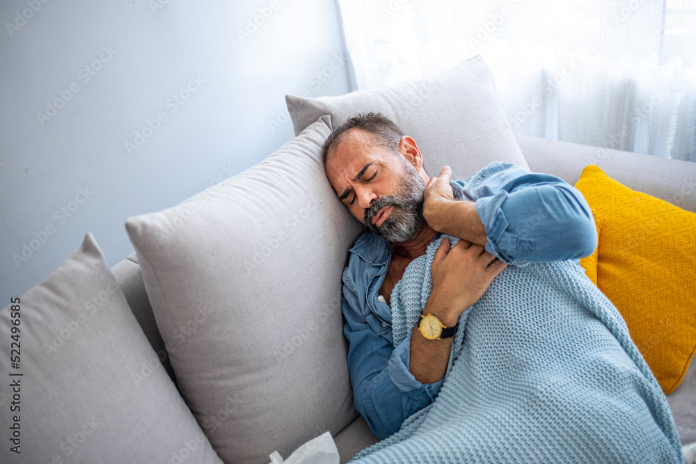 Foto de Health, cold and people concept - sick mature man in blanket ...