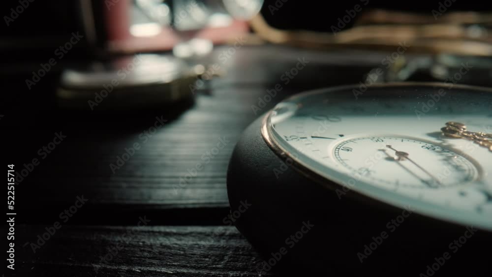 Silver antique pocket watch with ticking gold hands and vintage camera ...