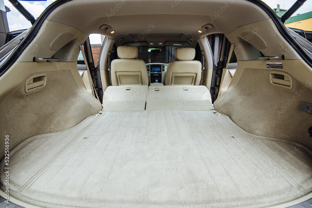 Luxury car boot with folded seats. Opened empty car trunk. Clean trunk ...