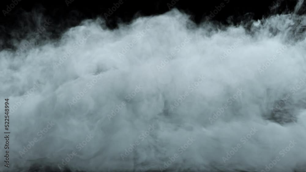 Streams of gray smoke falling from the top of the frame spreading out ...