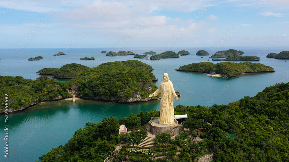 Aerial view of the hundred Islands national Park and the statue of ...