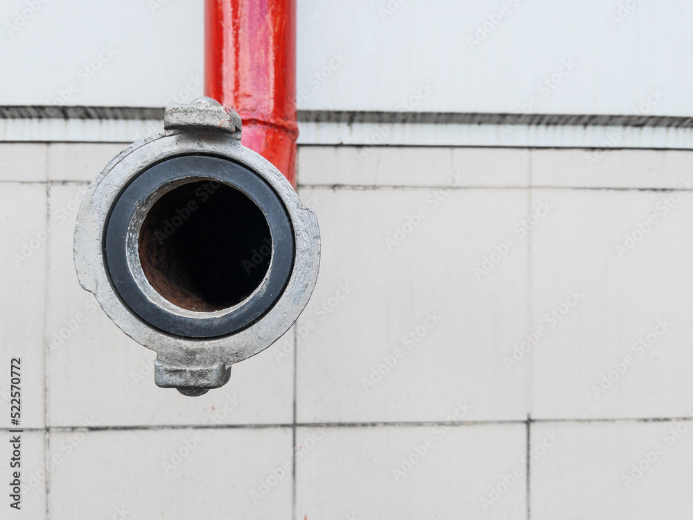 Red fire-fighting pipeline with a close-up lock Stock Photo | Adobe Stock