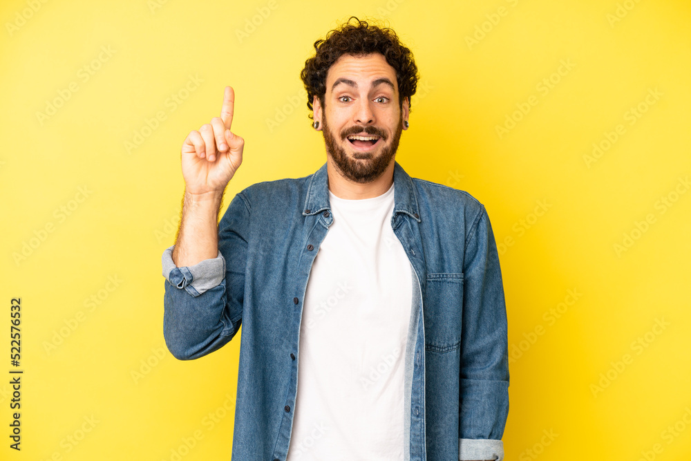 young bearded man feeling like a happy and excited genius after ...
