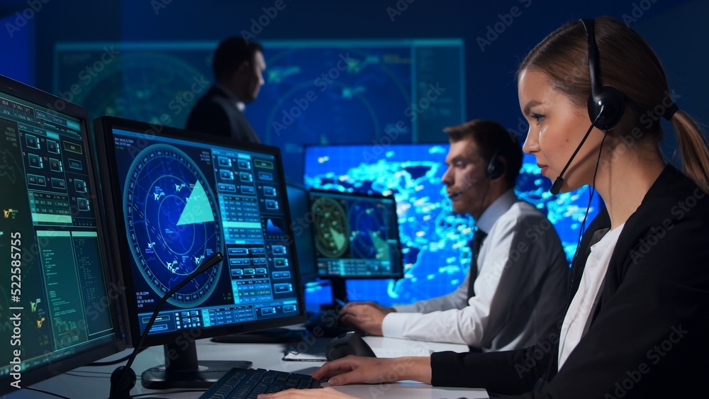 Workplace of the air traffic controllers in the control tower. Team of ...