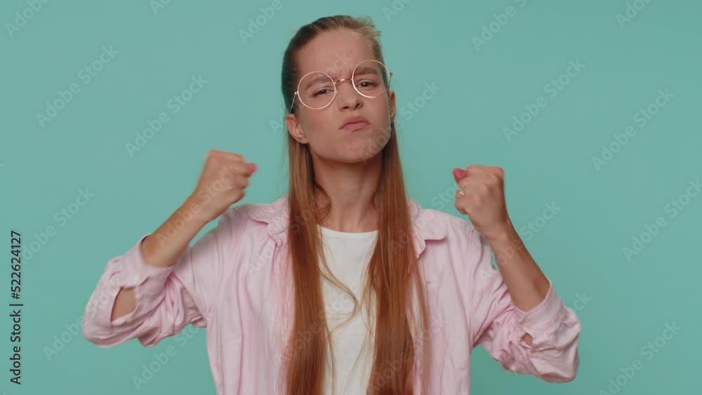 Aggressive angry pretty teenager girl in shirt trying to fight at ...