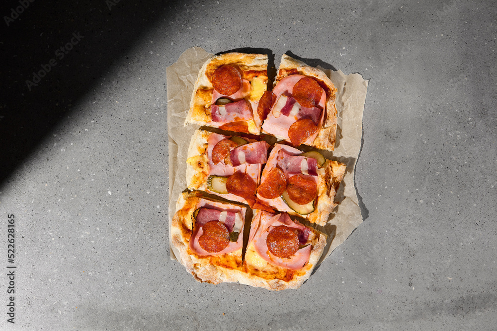 Traditional italian meat pizza with pepperoni and bacon on dark ...