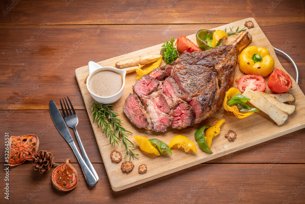 Barbecue Tomahawk Steak on wooden plate.Grilled tomahawk ribeye steak ...