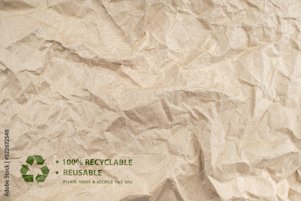 Recycled brown creased paper background from a paper packing with green ...