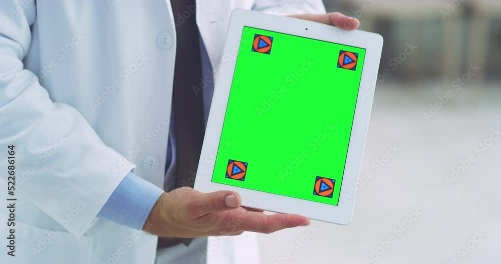 Closeup of medical doctor holding a green screen tablet with chromakey ...