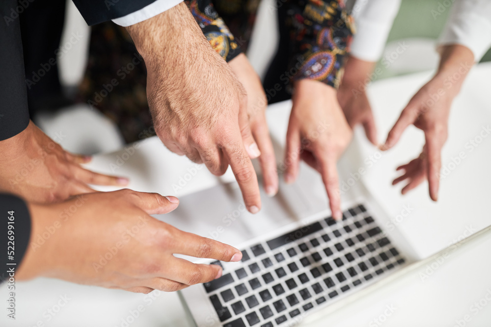 Many fingers point to the computer keyboard Stock Photo | Adobe Stock