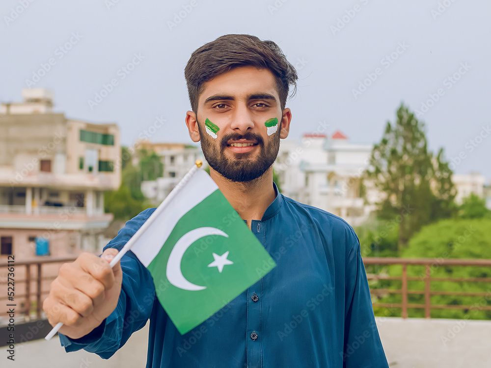 Pakistani boy with Pakistan Flags in hand, Pakistan Independence day ...