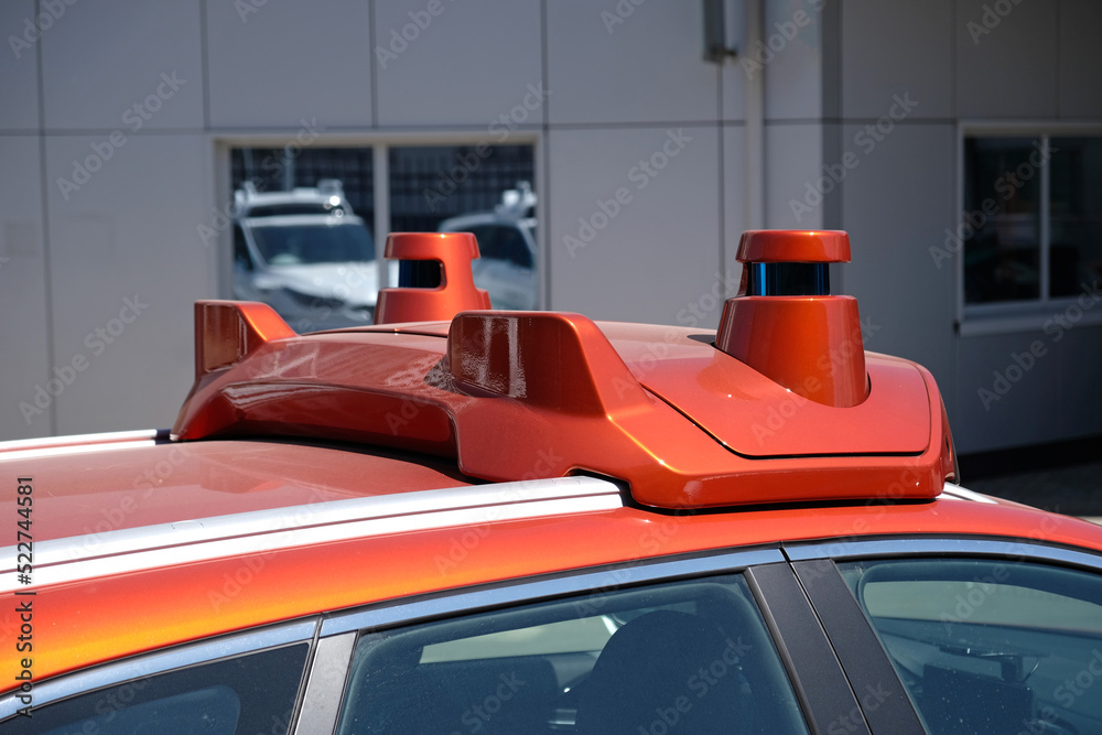 LiDAR sensors and Camera on roof of self-driving car. Self-driving car ...