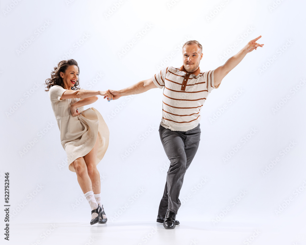 Dynamic portrait of emotional man and woman dancing sport dances ...