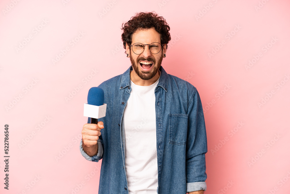 crazy bearded man shouting aggressively, looking very angry. presenter ...