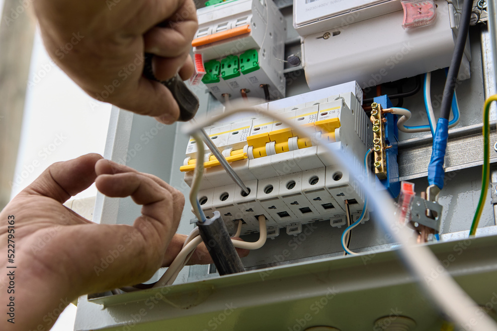 Fastening circuit breakers to DIN rail of consumer unit of electrical ...