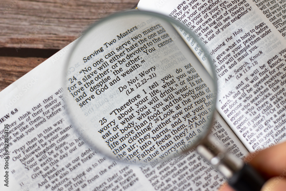 "Do not worry" biblical verse text in an open Holy Bible Book and a ...