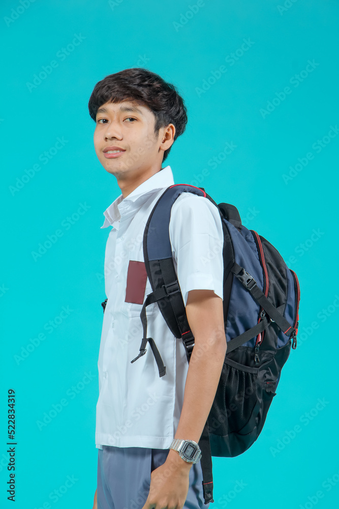 Indonesian male high school students wearing gray and white uniforms ...