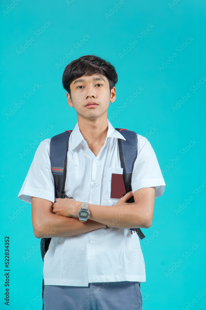 Indonesian male high school students wearing gray and white uniforms ...