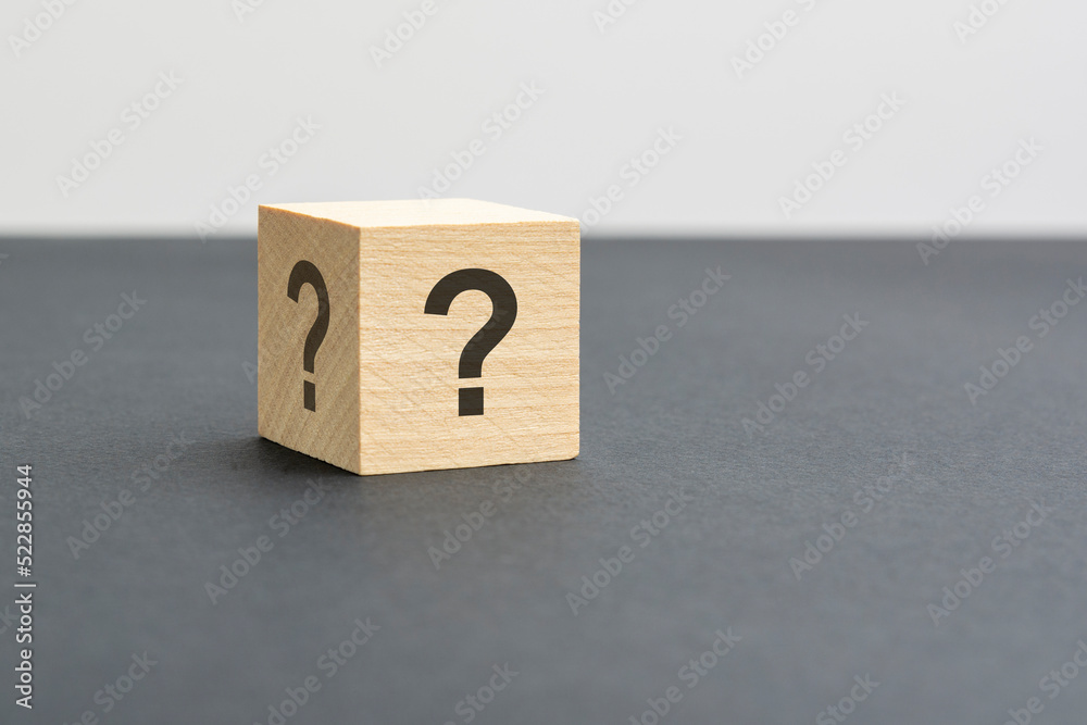 wooden block with question marks on black background, business teamwork ...