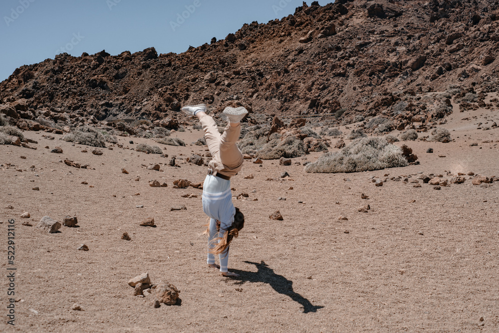 Husband and wife in the sand desert. A loving couple hugs and kisses. A ...