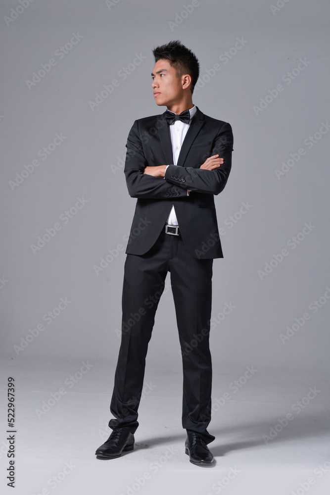 Handsome fashion model. Full body elegant man wear formal black suit ...