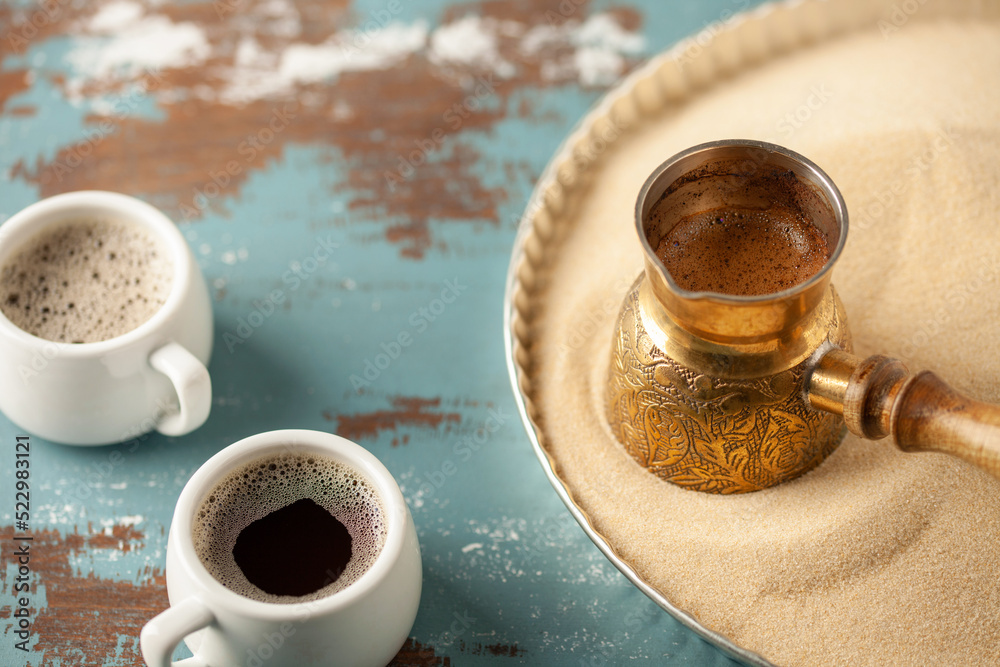 Traditional turkish coffee in cezve prepared on hot sand. Stock Photo ...