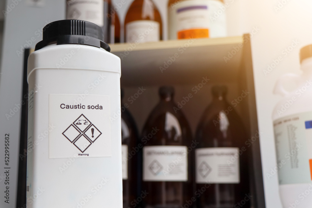 Caustic soda in bottle, chemical in the laboratory Stock Photo | Adobe ...