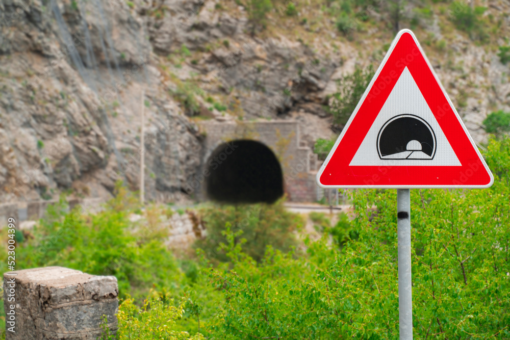 Triangular sign with a red outline indicating the approach to a section ...