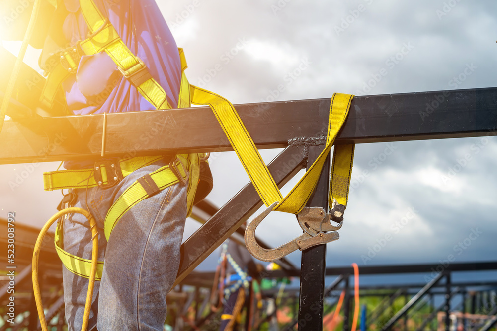 Safety belts worn by construction workers when working at heights ...