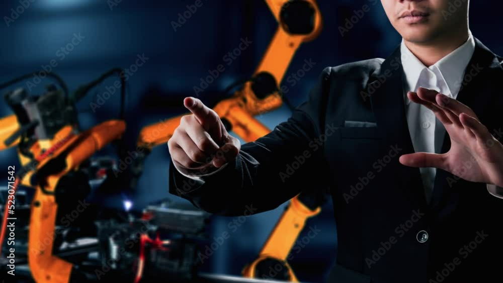 Engineer use cybernated robotic software to control industry robot arm ...