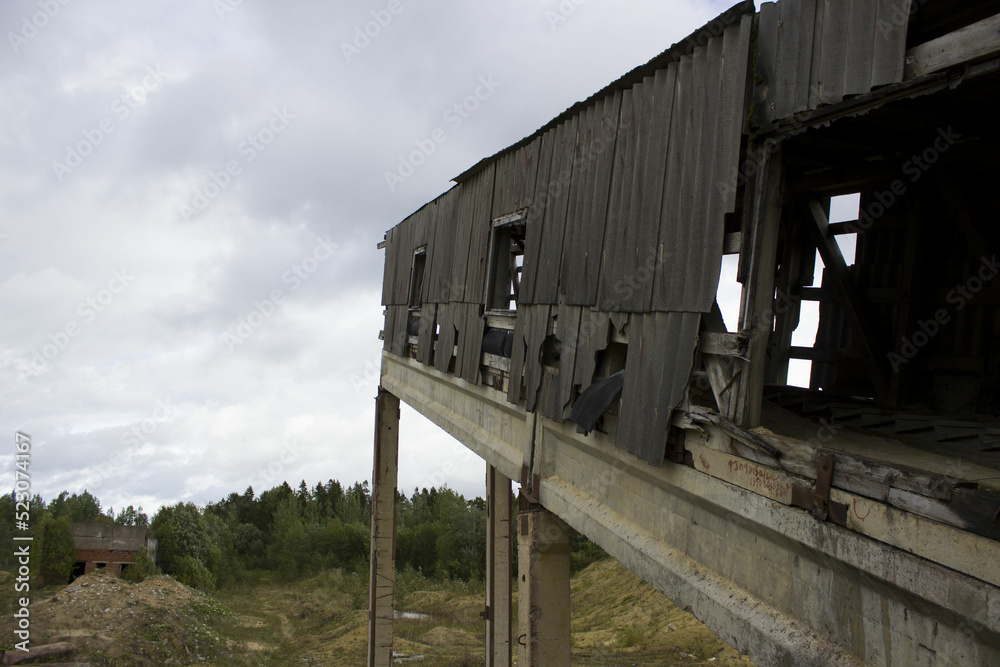 stairs leading to heaven. ruined industrial building on stilts with a ...