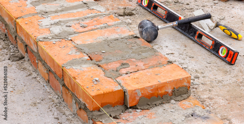 initial rows of brickwork. the initial stage of building a house ...