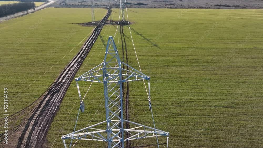 Aerial circling view of steel erector workers strengthen a newly ...