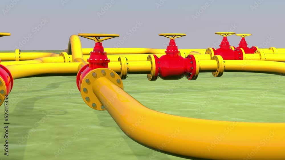 Yellow gas pipe with a crane goes along the facade of a new multistorey ...