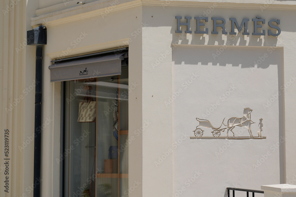 HERMES fashion retail text brand and sign logo store facade in city ...