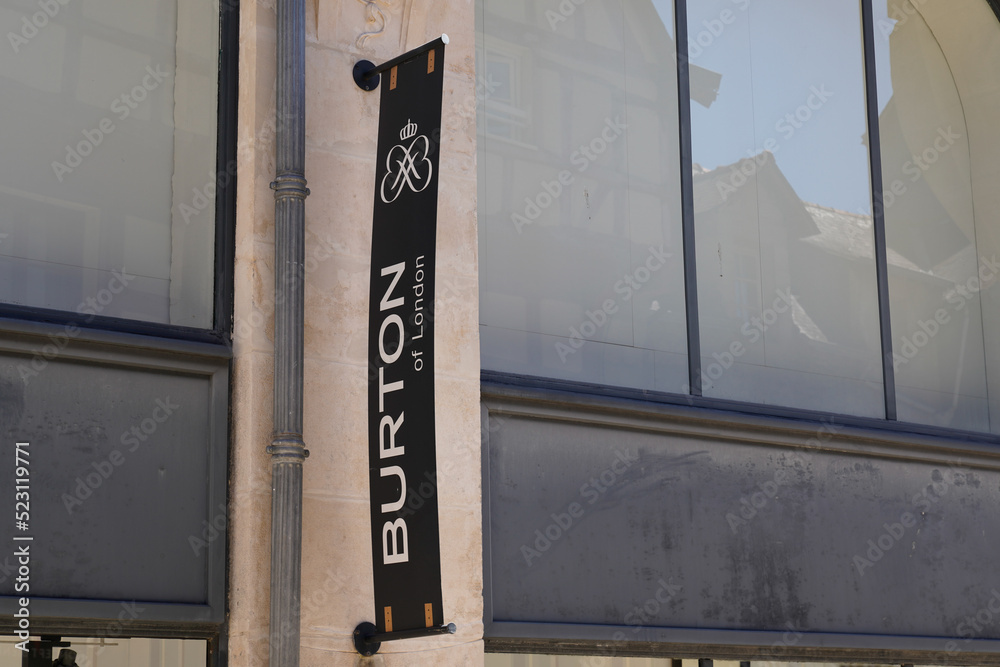 Burton of london sign brand and text logo on store front facade british ...