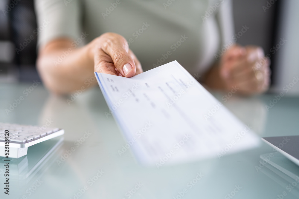 Giving Paycheck Or Payroll Cheque Stock Photo | Adobe Stock