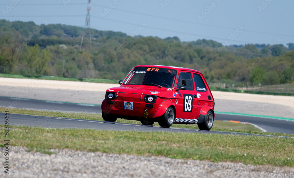Vintage italian classic Fiat 126 racing car action on racetrack Stock ...
