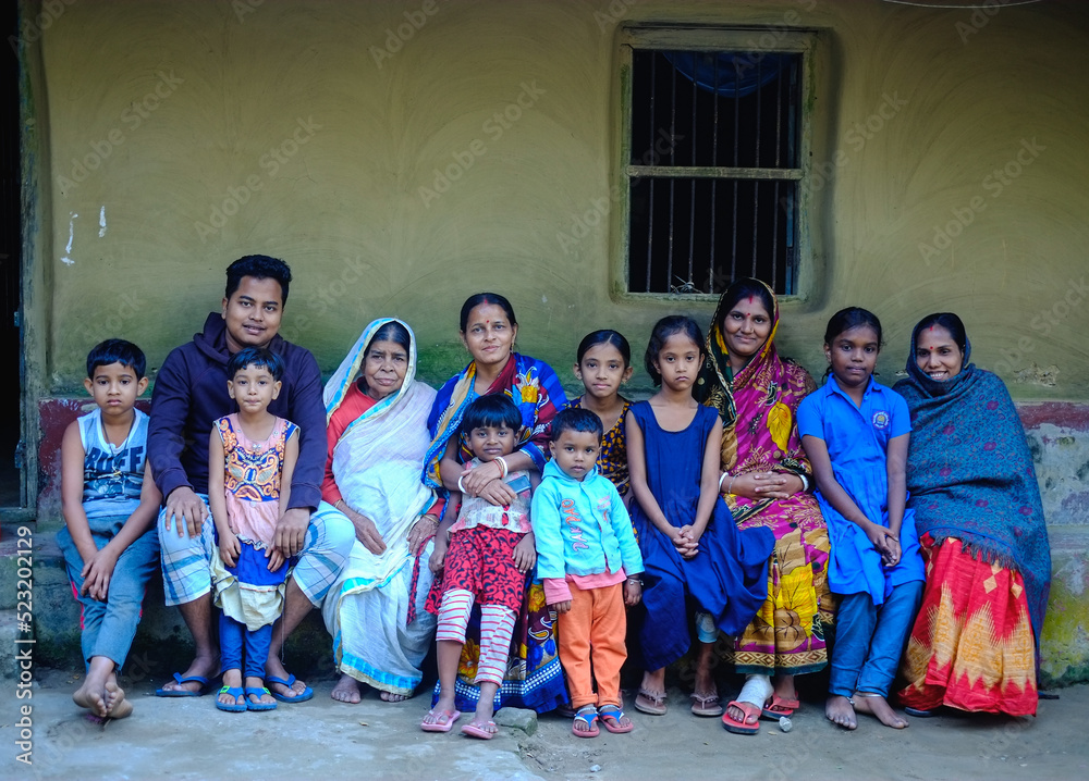 South asian combined family photo, a group of Bangladeshi hindu religious village people sitting ...