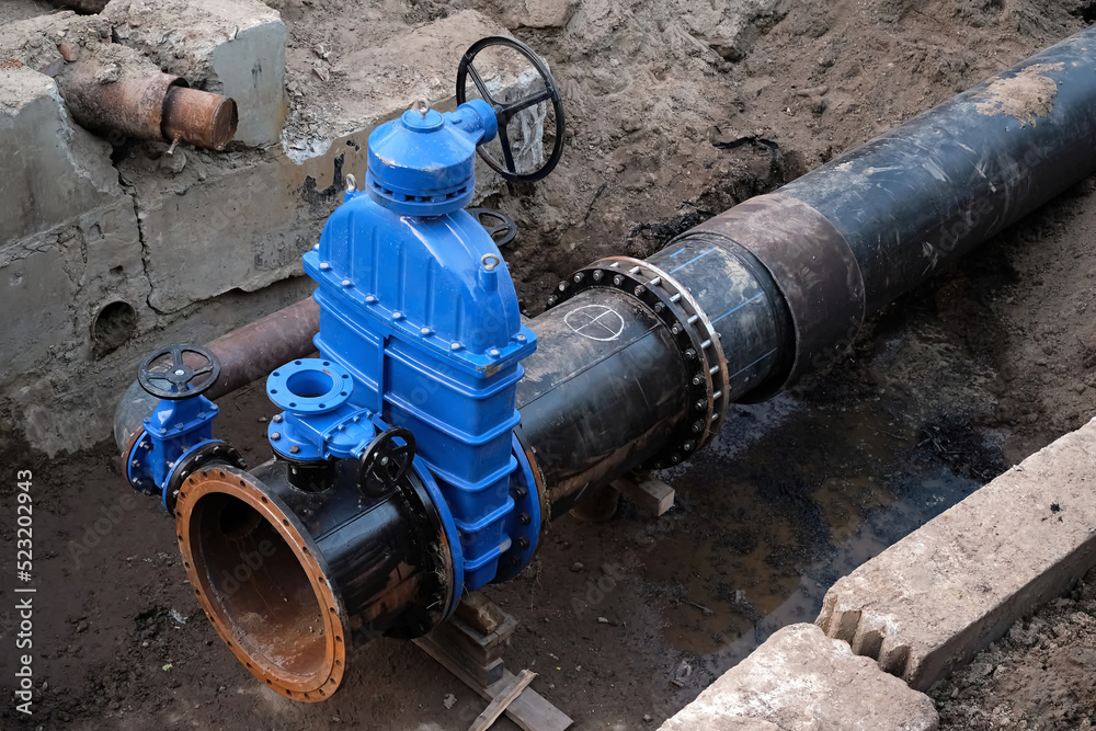 piping with new Gate valves and reduction. Laying heating pipes in a ...